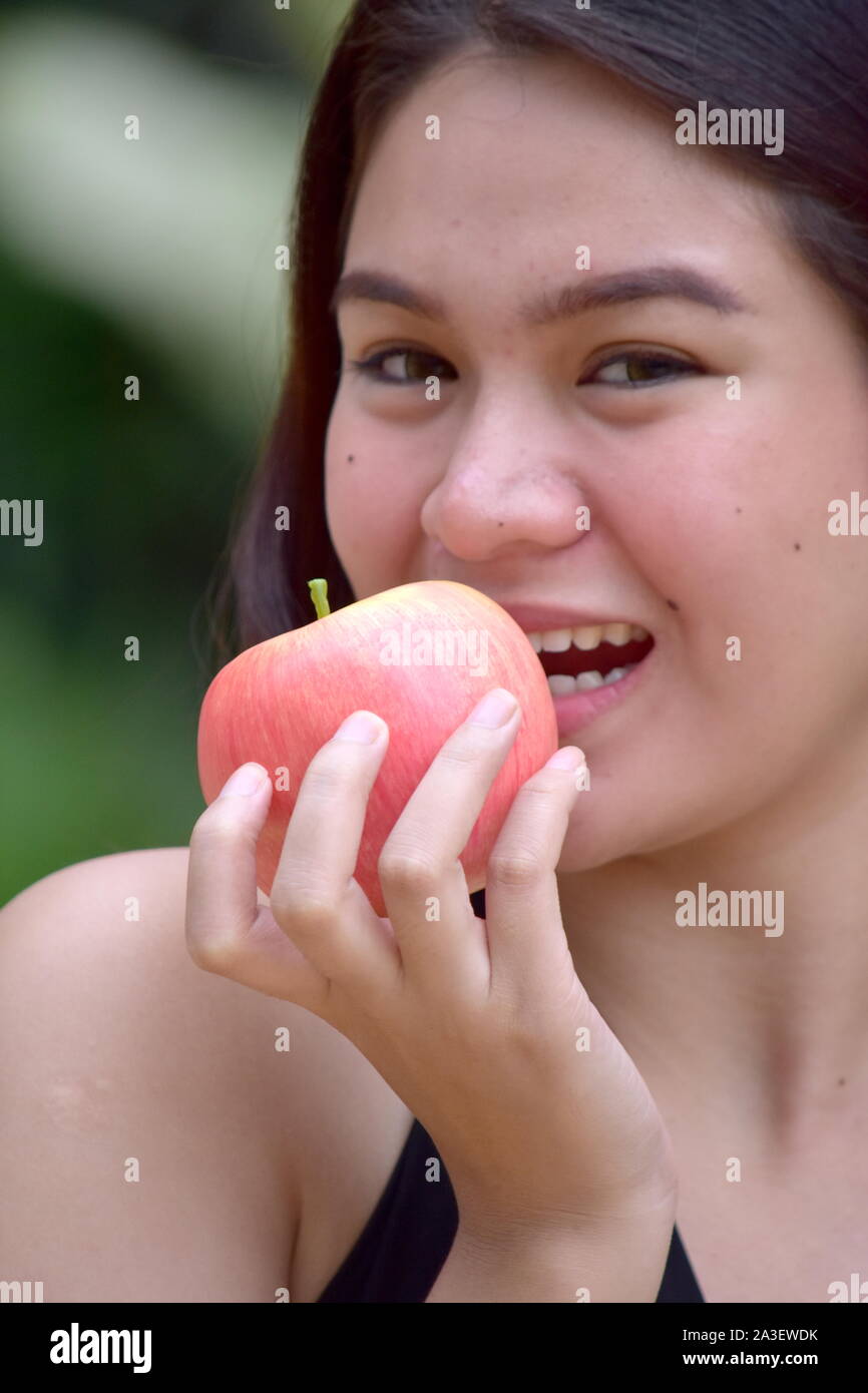 A Pretty Female Eating With Food Stock Photo - Alamy