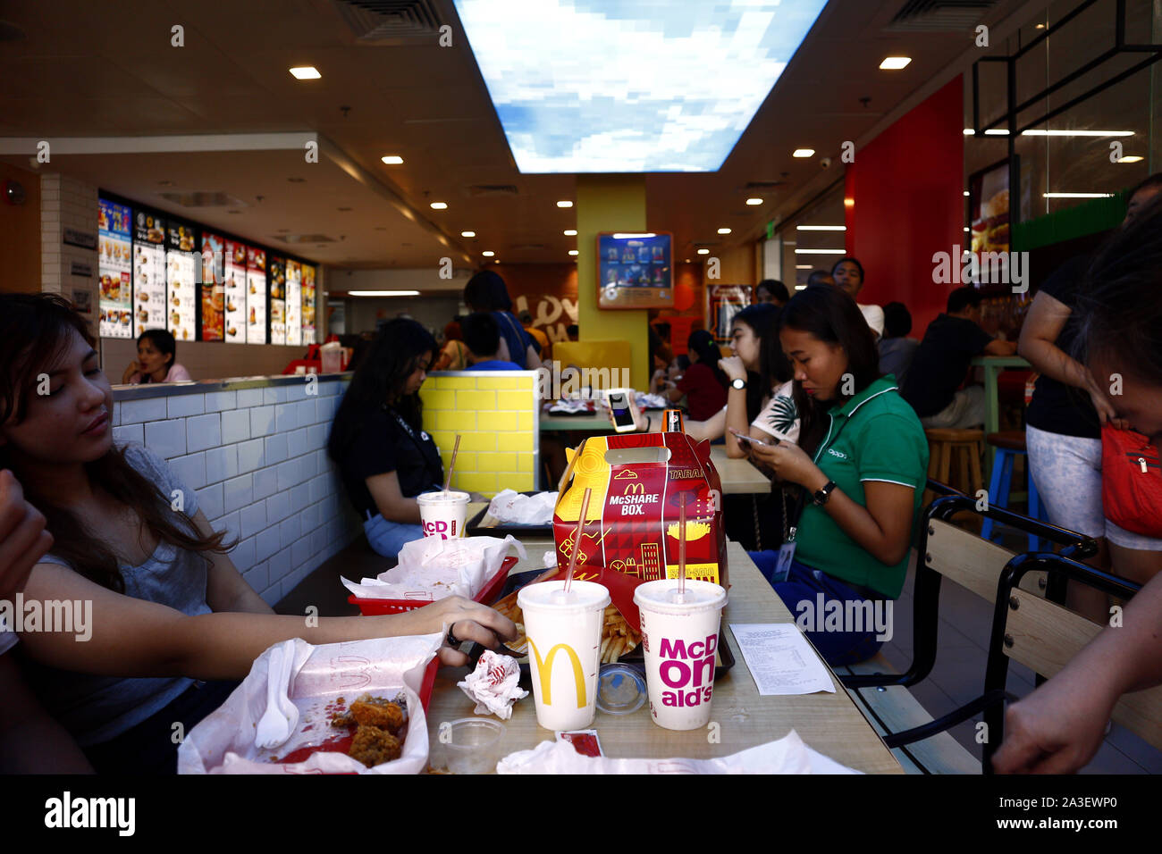 PASIG CITY, PHILIPPINES – SEPTEMBER 29, 2019: Customers enjoy their ...