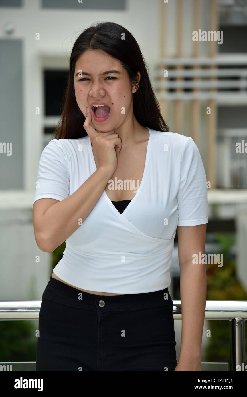 Young Asian Adult Female With Toothache Stock Photo - Alamy