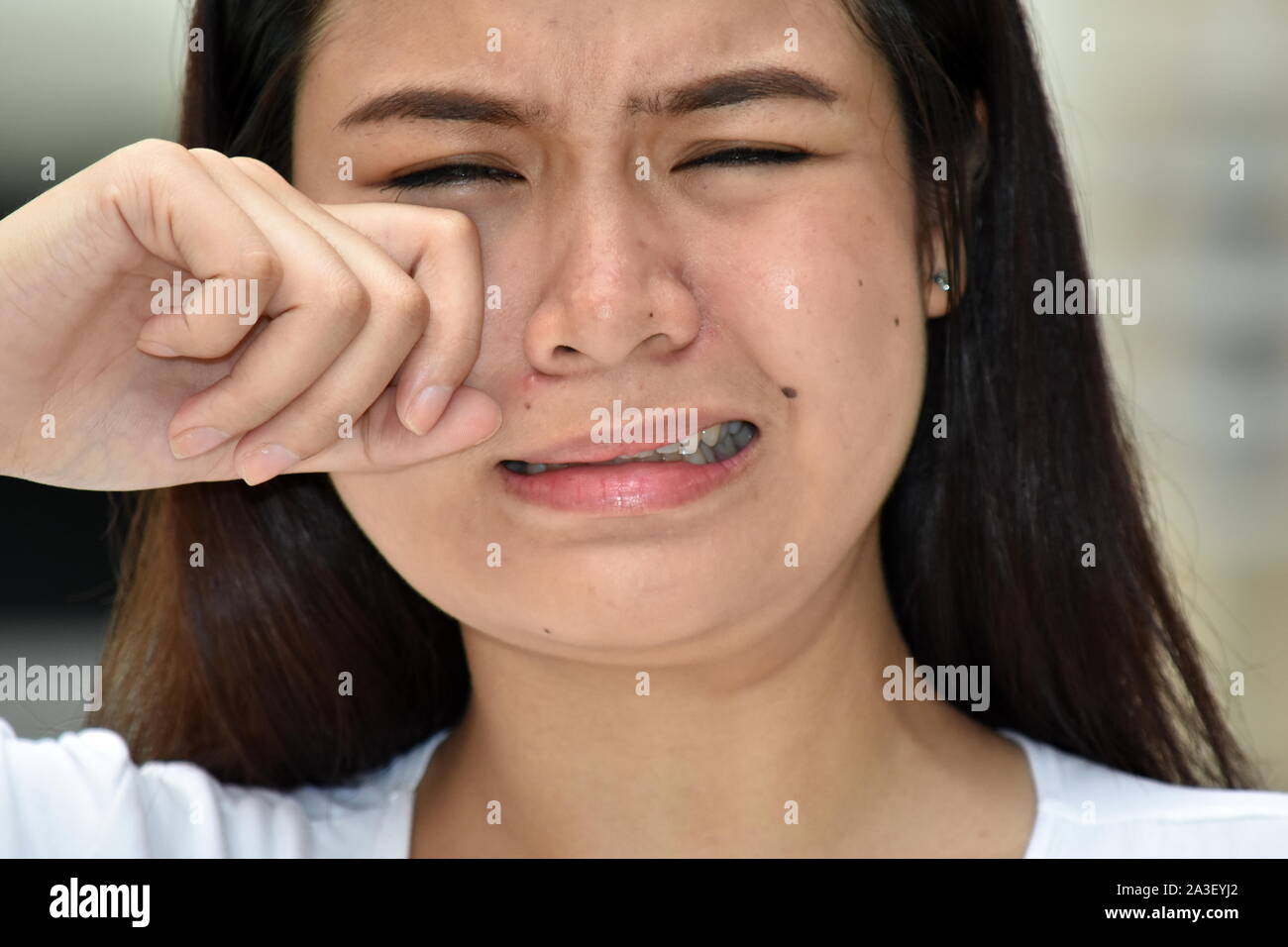 A Tearful Female Woman Stock Photo - Alamy