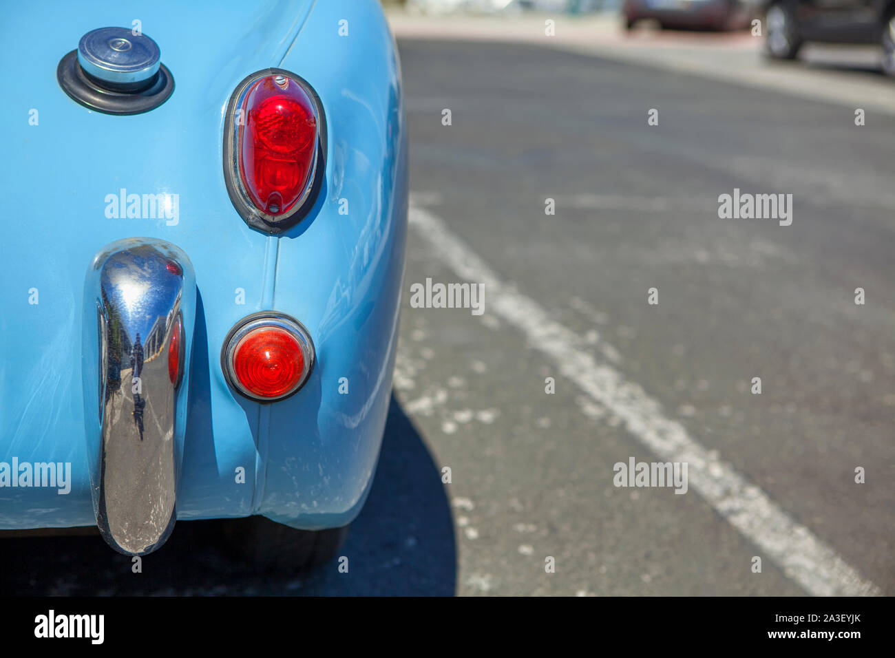 Blue vintage car on the road Stock Photo - Alamy