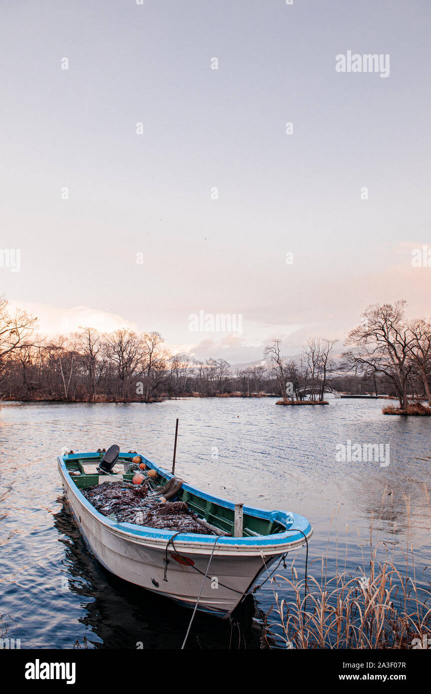 Fishing boat at Onuma Koen Quasi -National park in peaceful cold winter ...