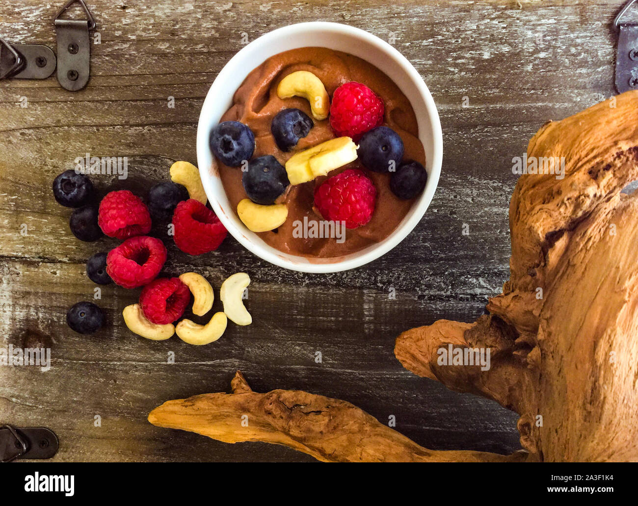 Fuite and mousse on flat wood and white background. A breakfast ready ...