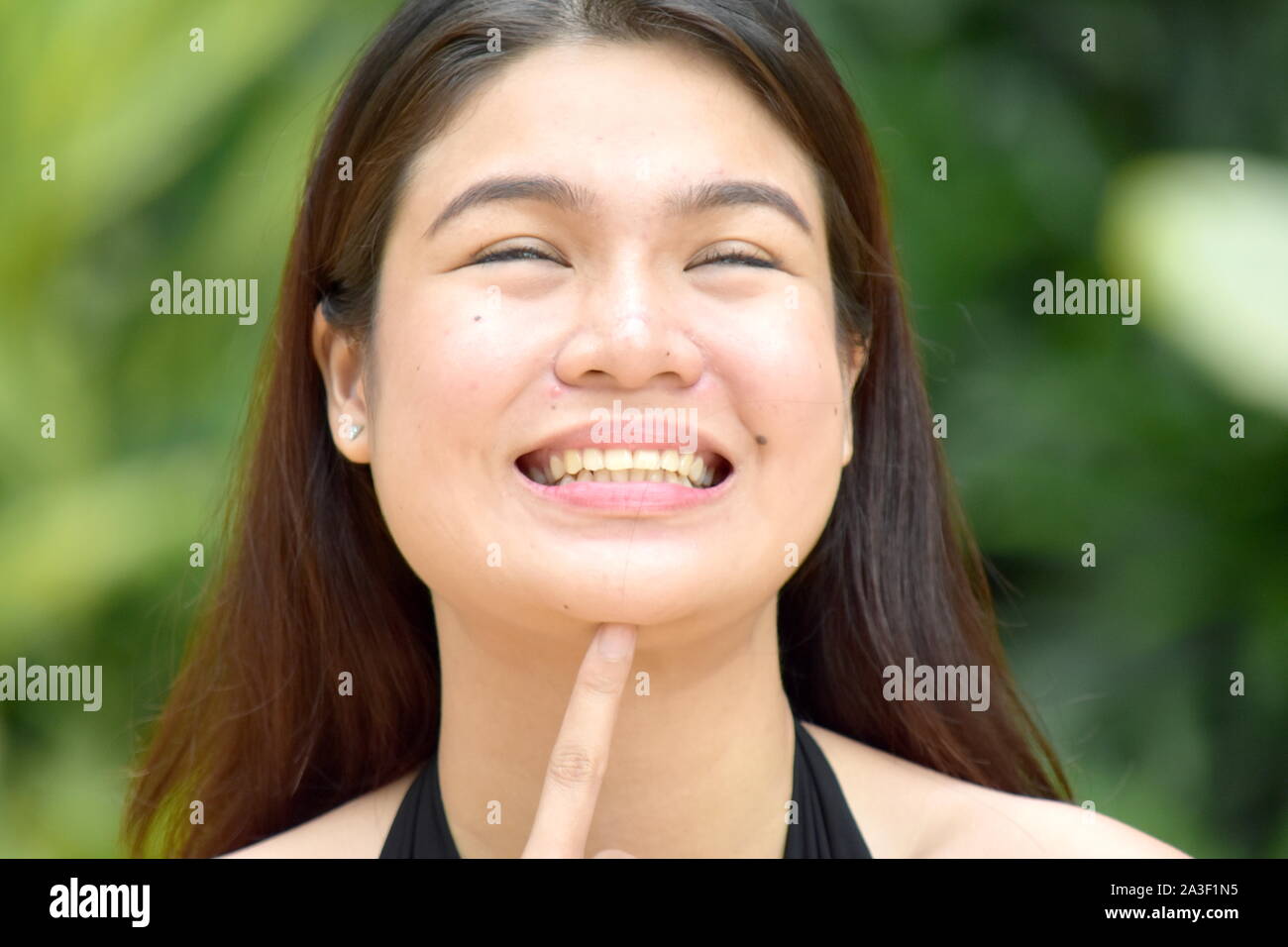 An Attractive Asian Female Thinking Stock Photo - Alamy