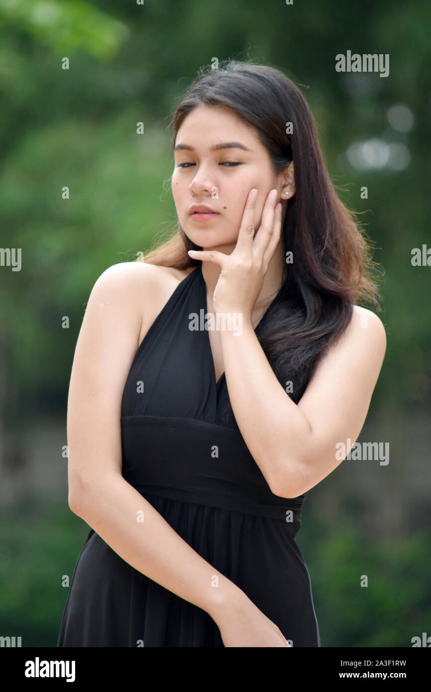 A Thoughtful Asian Person Stock Photo - Alamy
