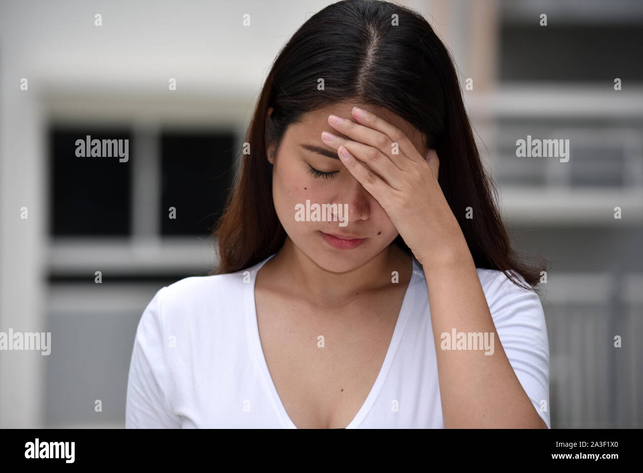 An Asian Female Under Stress Stock Photo - Alamy