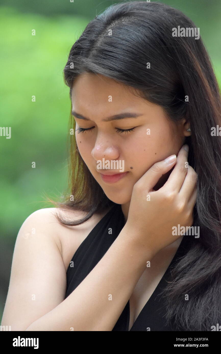 A Depressed Filipina Woman Stock Photo - Alamy