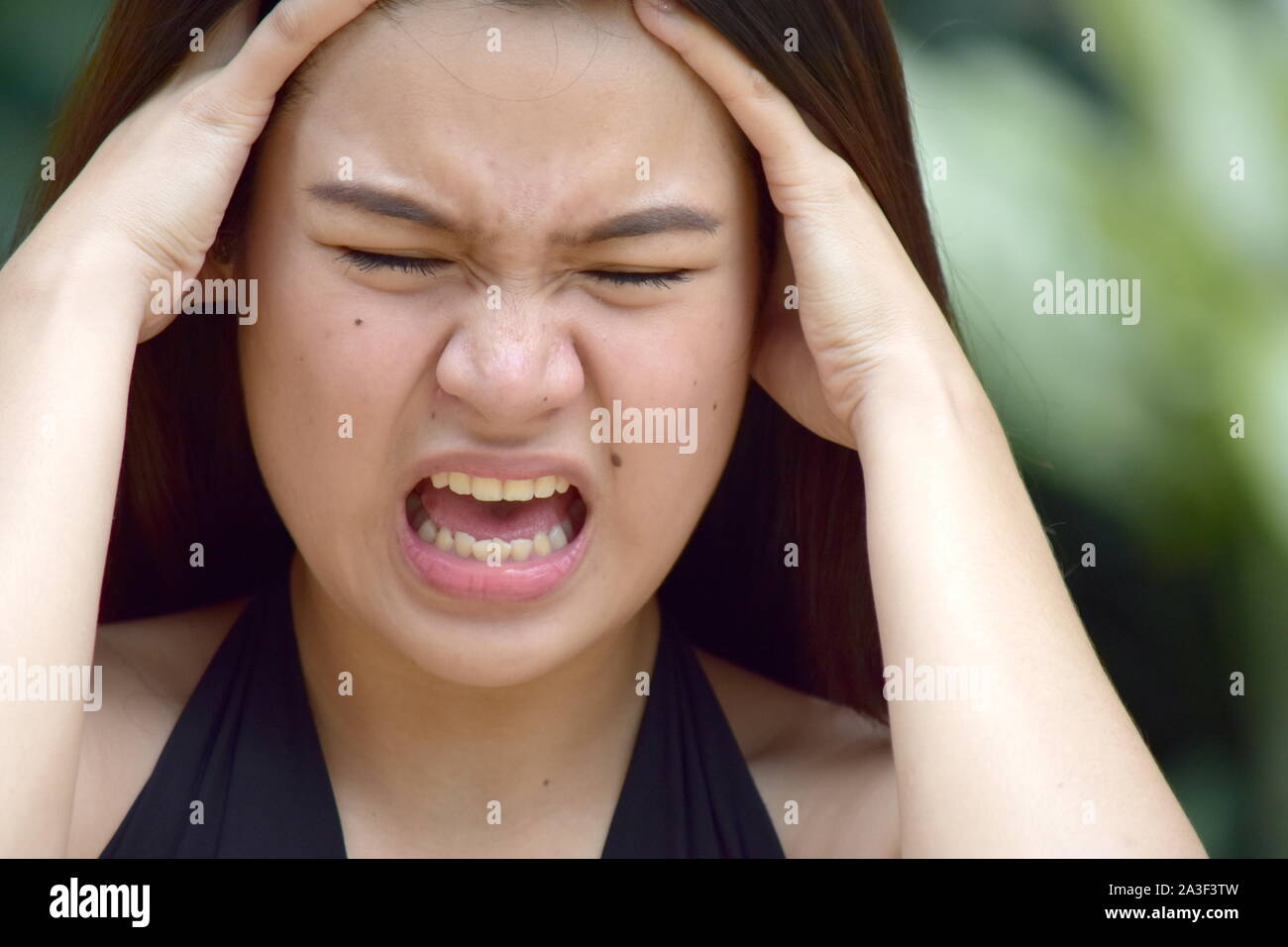 An Asian Female Under Stress Stock Photo - Alamy