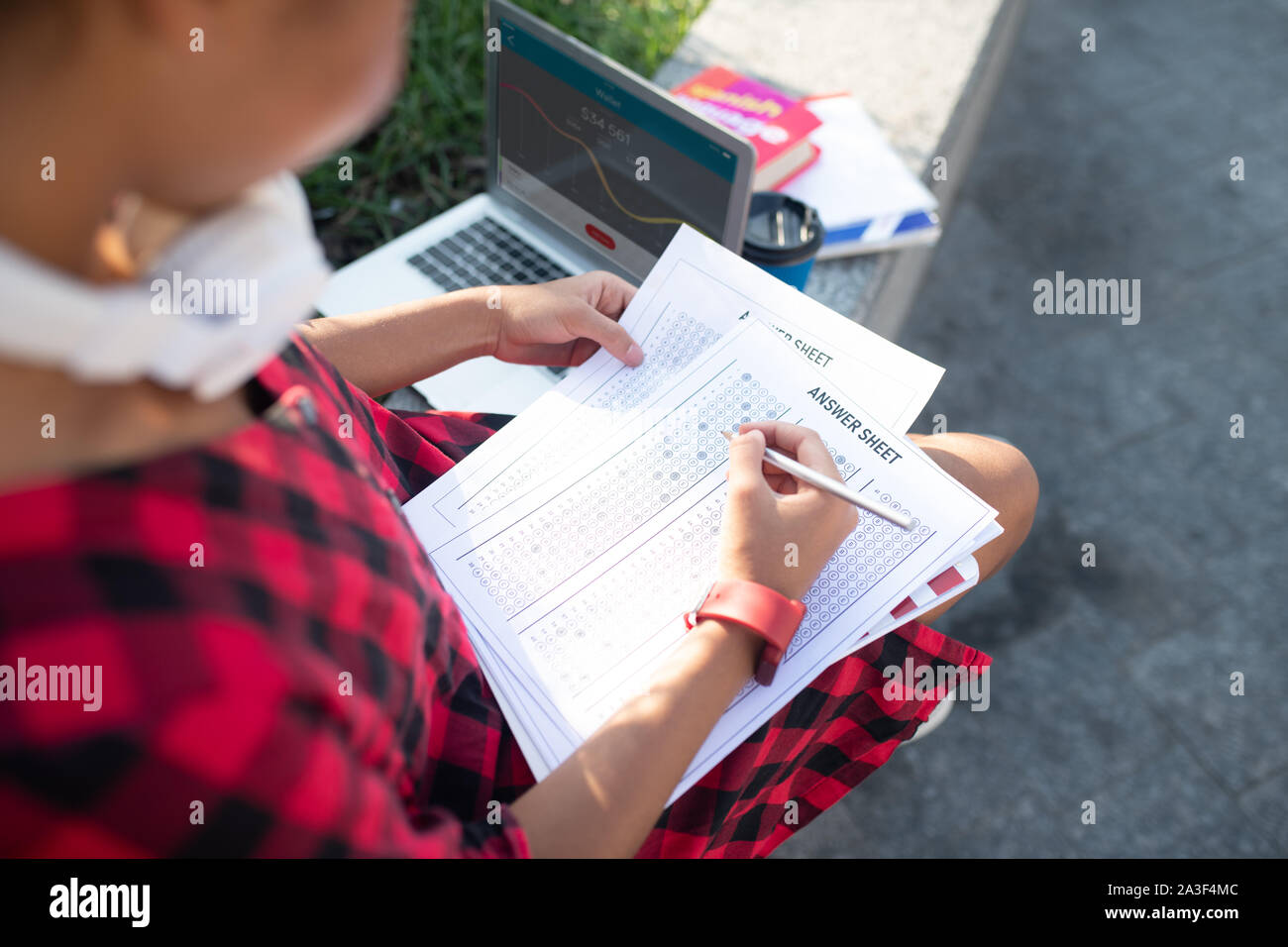 Top view of student wearing smart watch preparing for test Stock Photo ...
