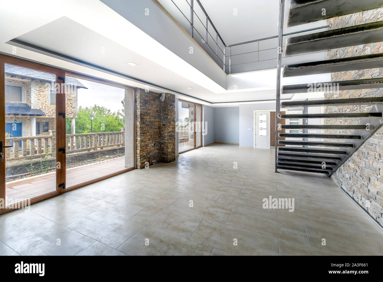 Empty and unfurnished brand new modern house. Beautiful big living room ...