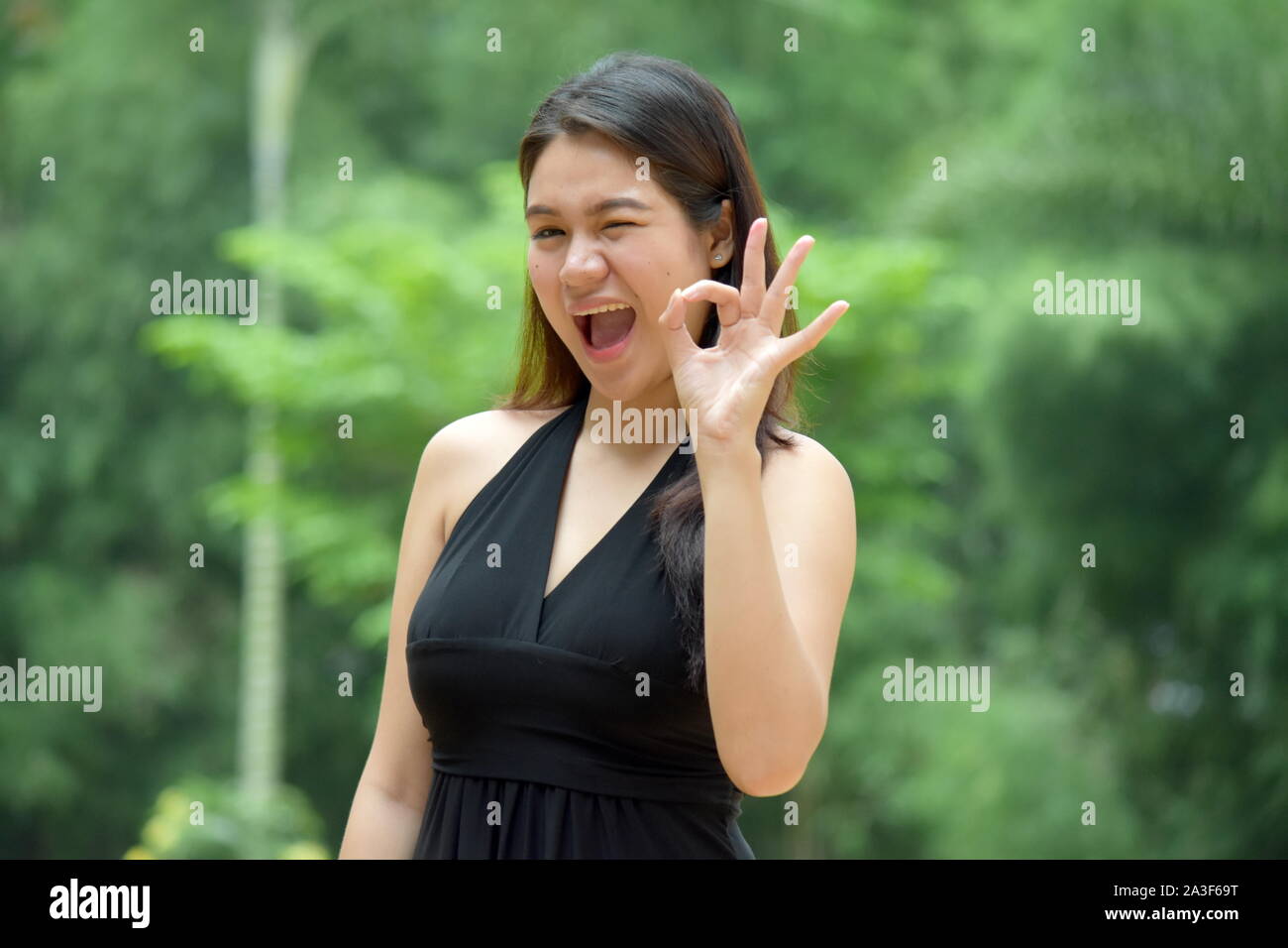 Pretty woman okay sign hi-res stock photography and images - Alamy