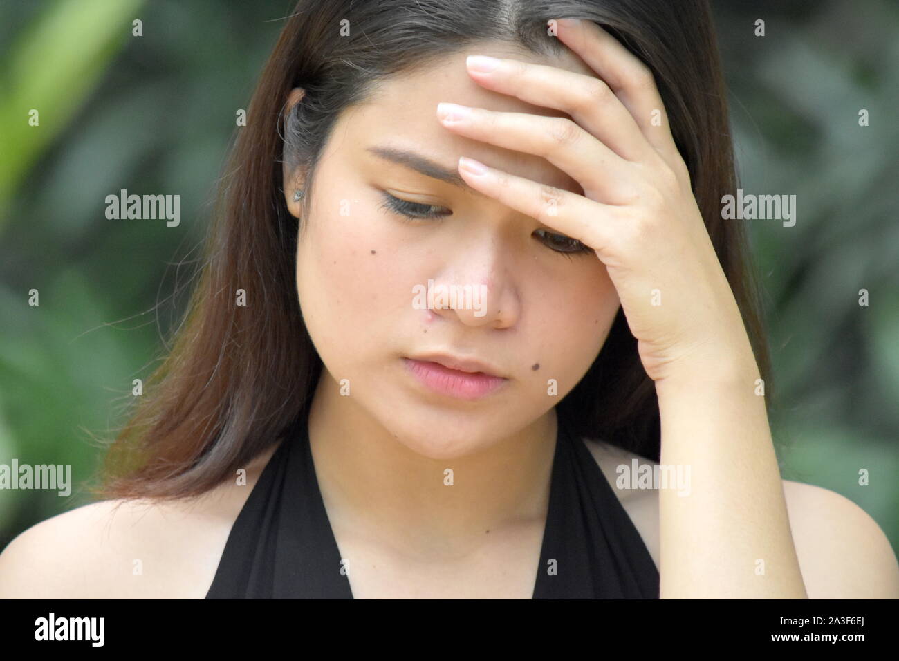 A Worrisome Filipina Female Stock Photo - Alamy