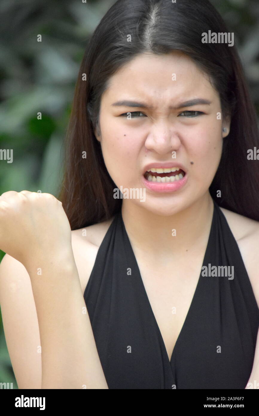 A Stressed Asian Person Stock Photo - Alamy