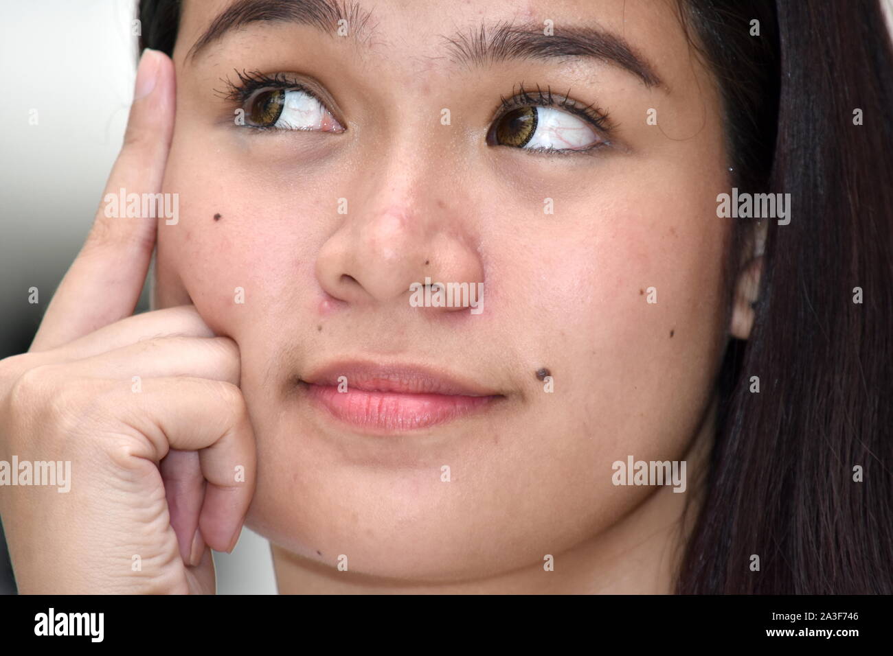 A Beautiful Female Thinking Stock Photo - Alamy