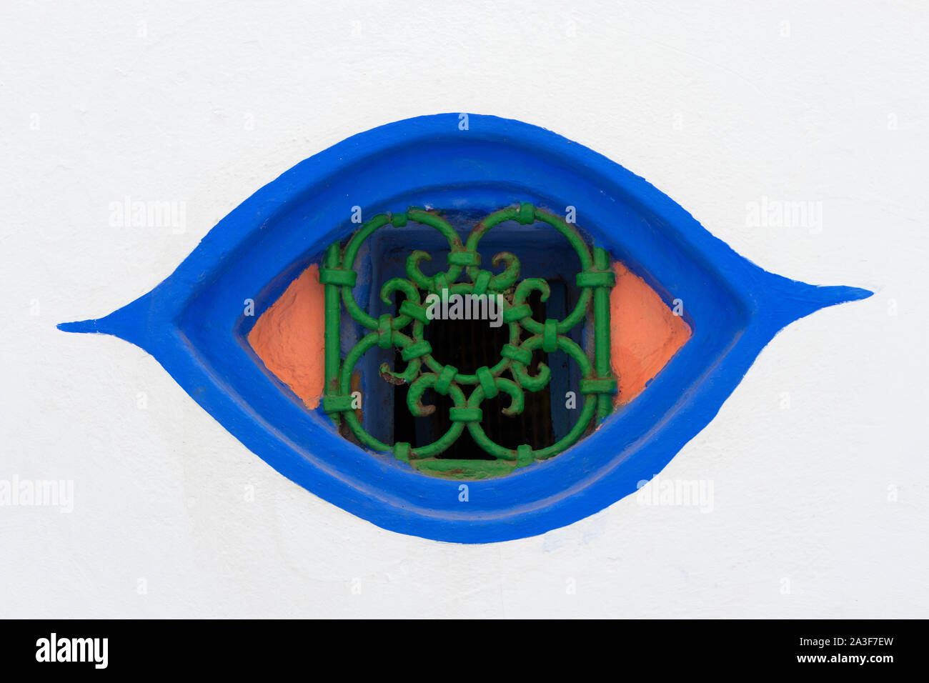 Moroccan colorful design window in the shape of an eye with a metal ...