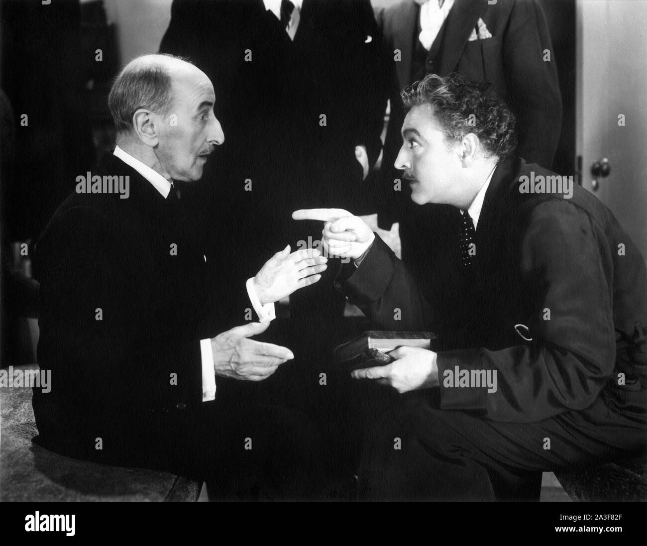 JOHN BARRYMORE as Oscar Jaffe and ETIENNE GIRARDOT as Matthew J. Clark ...
