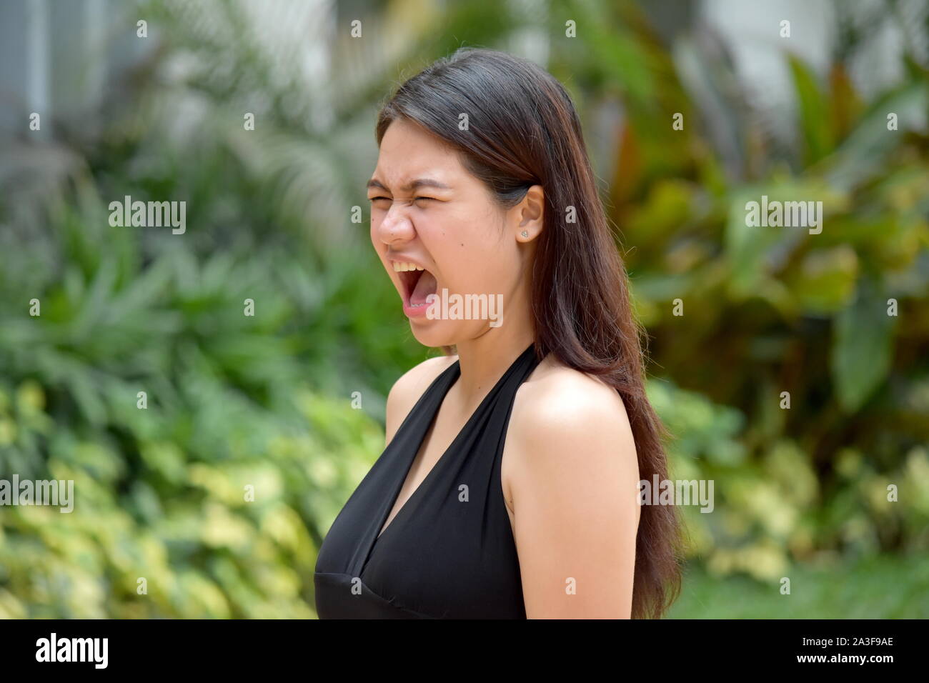 Pretty asian woman looks hi-res stock photography and images - Alamy