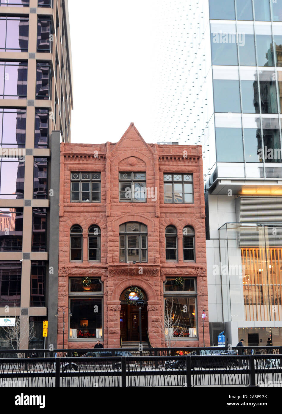 An old building squeezed between new buildings in Salt Lake City's city ...