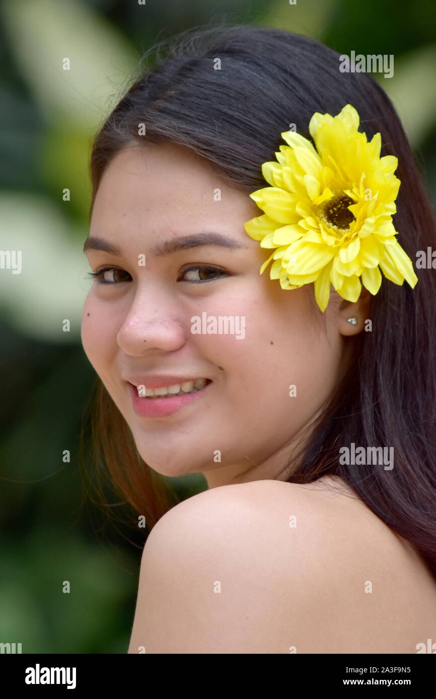 Smiling Asian Female With A Daisy Stock Photo - Alamy