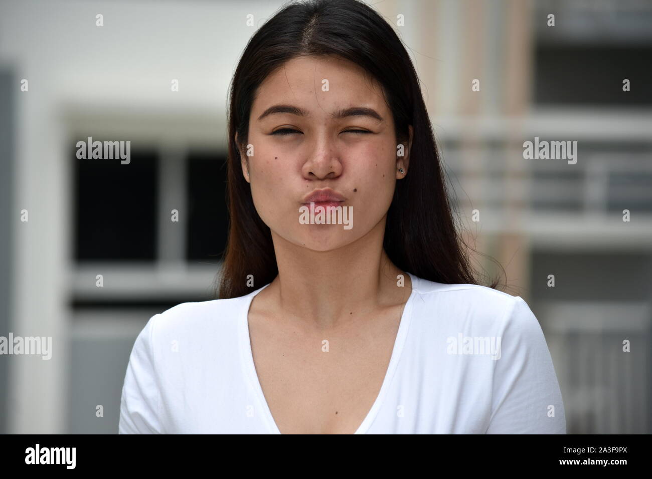 A Beautiful Asian Female Winking Stock Photo - Alamy