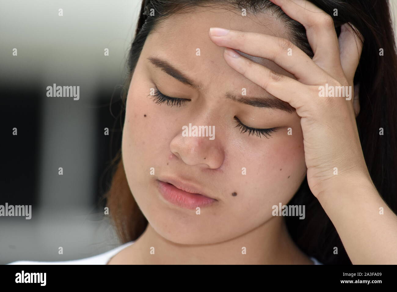 A Worried Young Diverse Female Stock Photo - Alamy