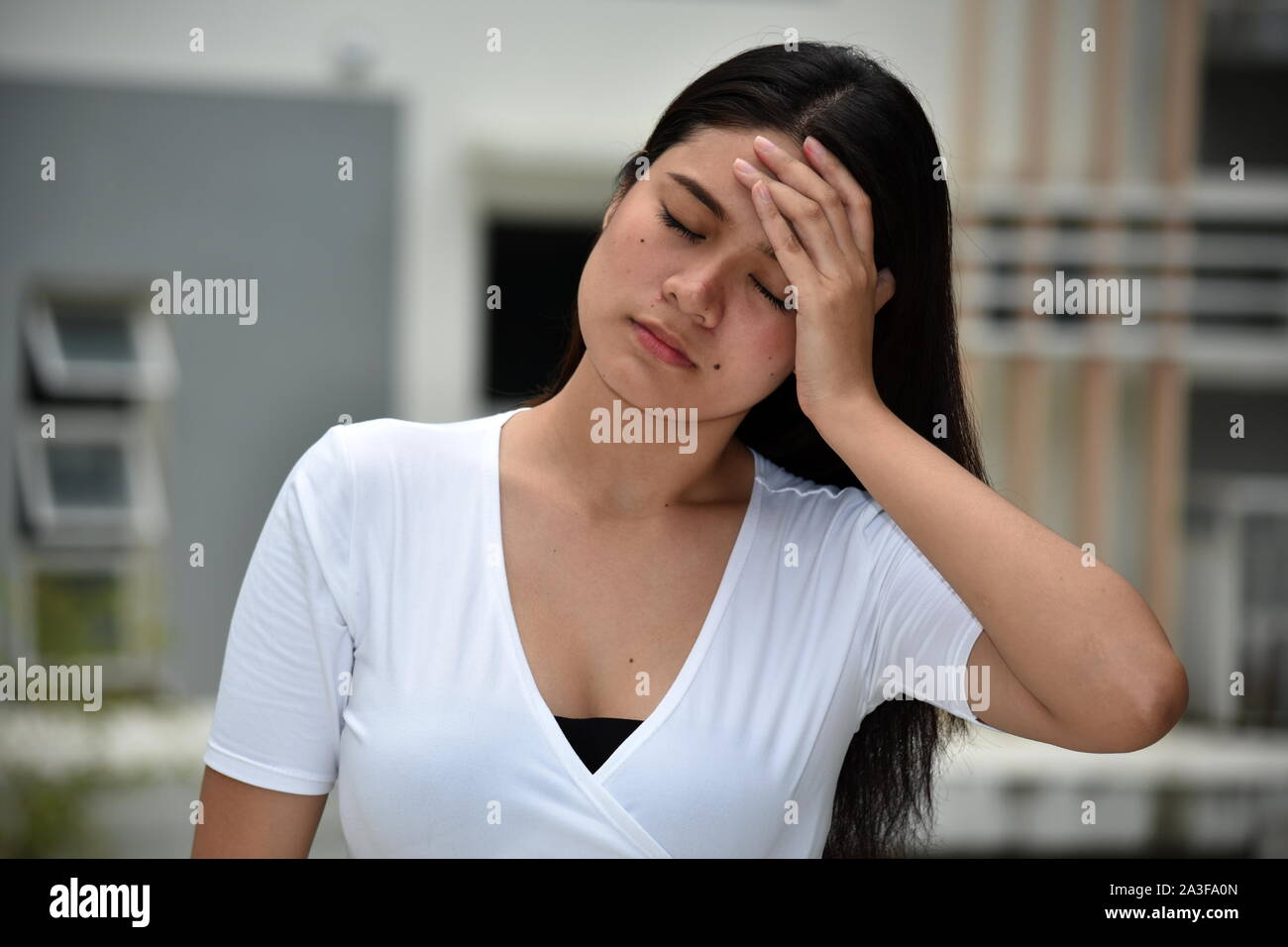 A Youthful Asian Female And Stress Stock Photo - Alamy