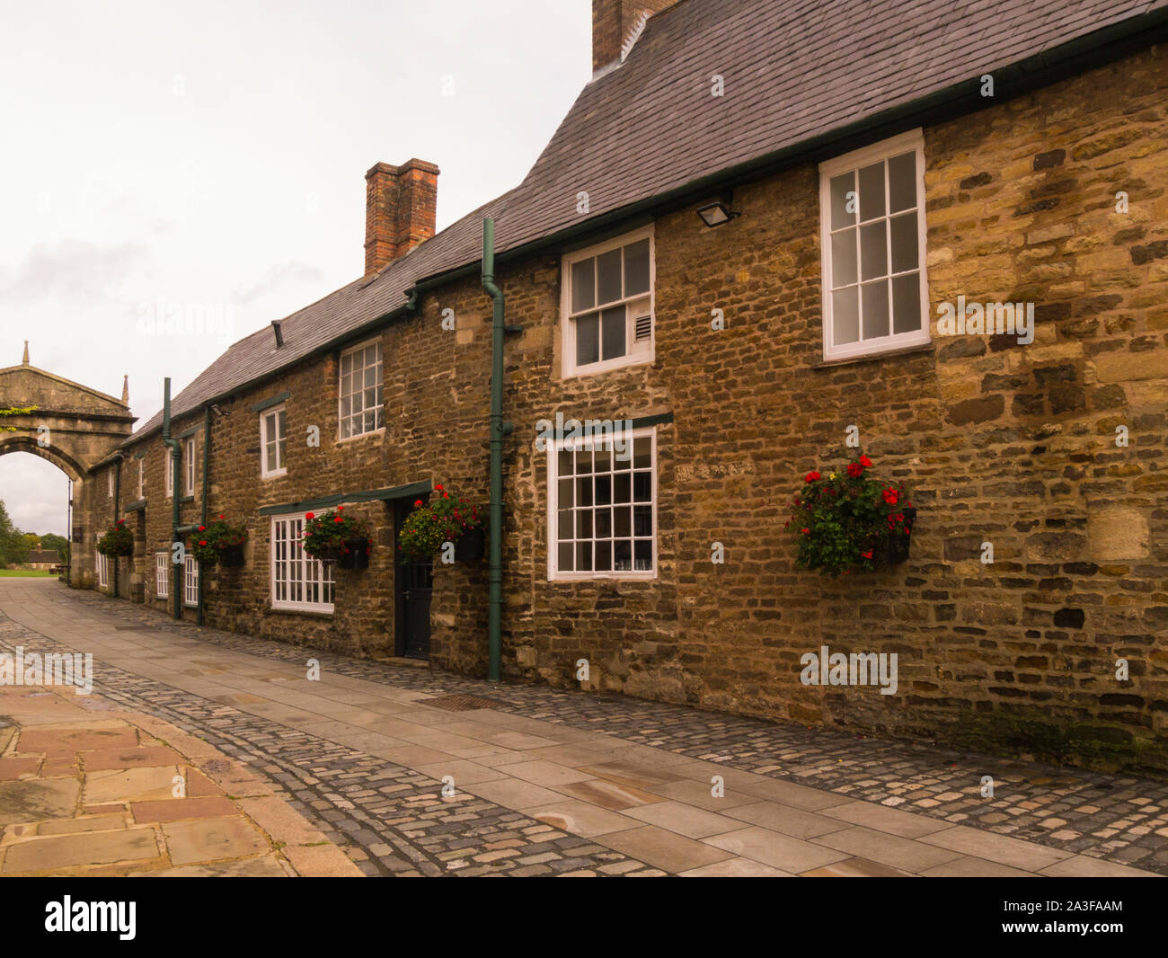 Lovely terraced row of red brick houses on narrow passage leading to ...