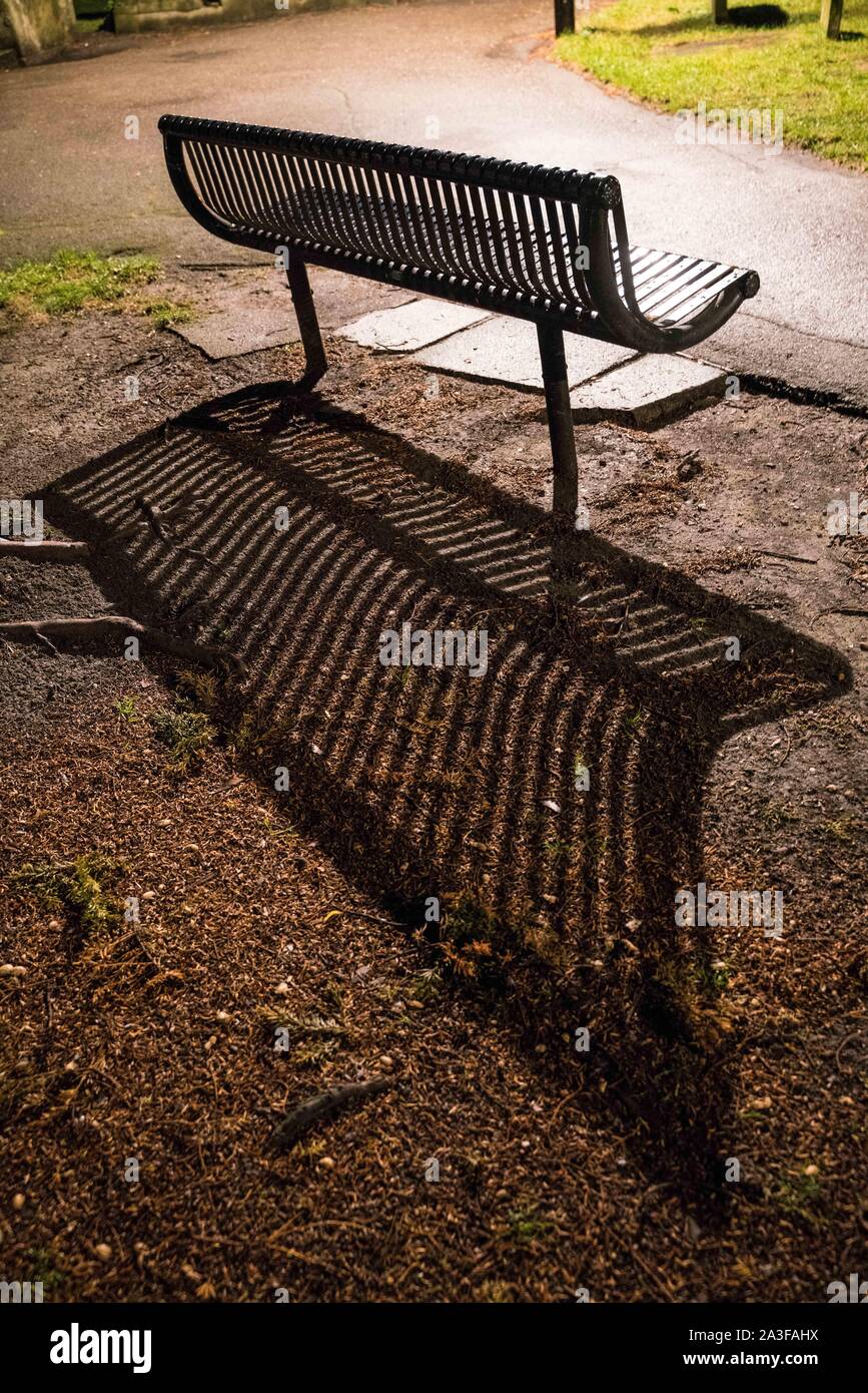 Park bench at night Stock Photo - Alamy