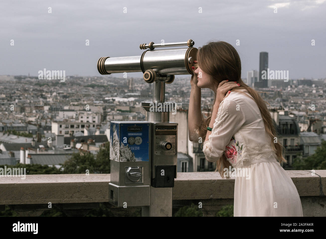 Travelling girl in Paris morning enjoying the morning view of city ...