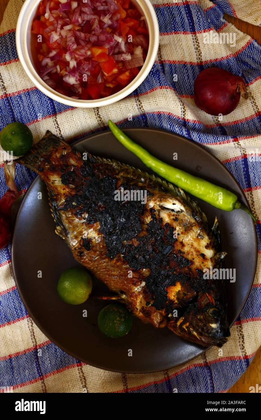 Garnishing fish hi-res stock photography and images - Alamy