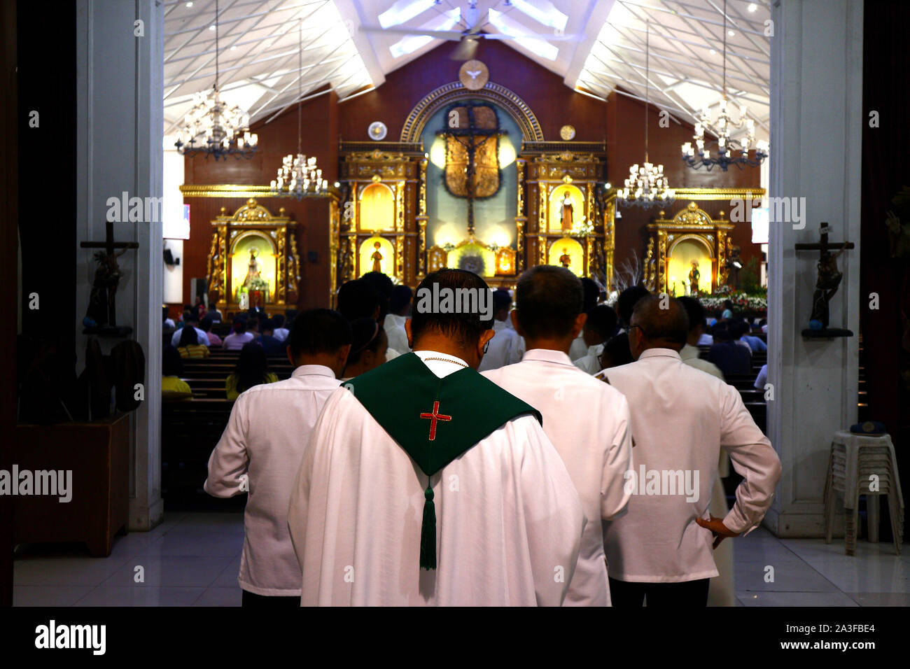 CAINTA, RIZAL, PHILIPPINES – OCTOBER 5, 2019: Priest and church ...