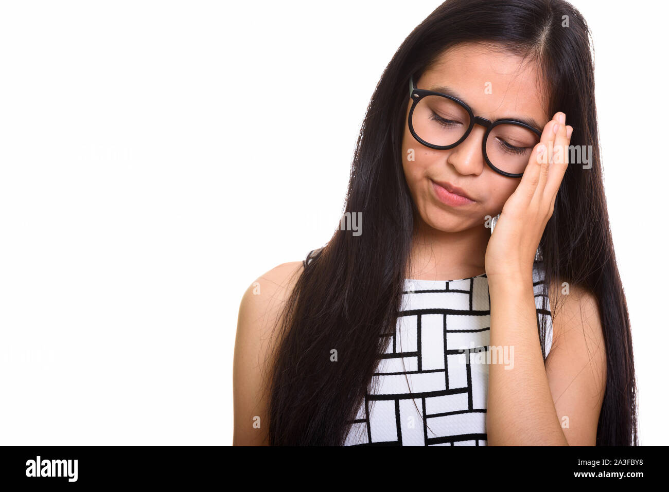 Young Asian teenage nerd girl looking tired Stock Photo - Alamy