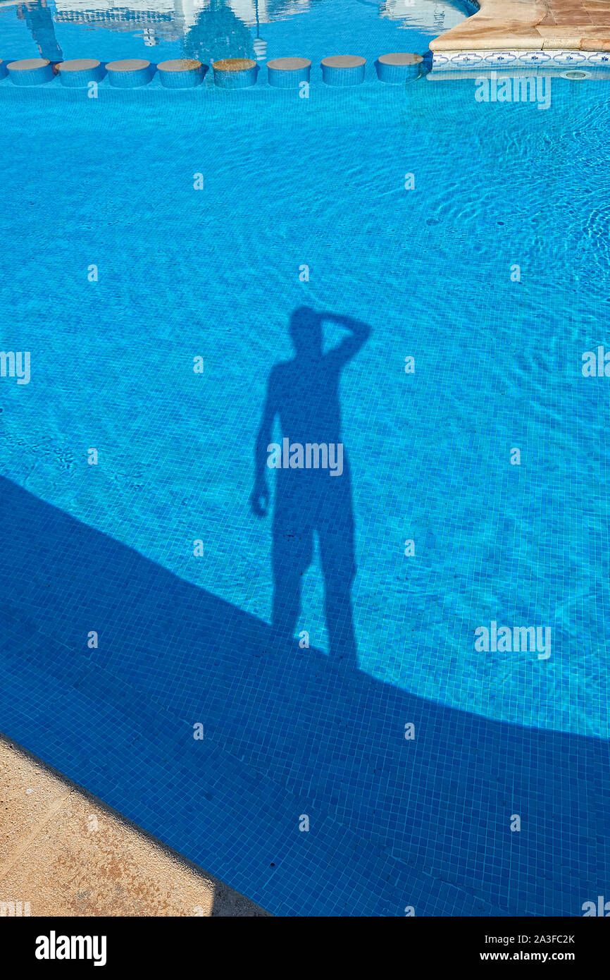 Textured water in swimming pool and hard shadow silhouette Stock Photo ...