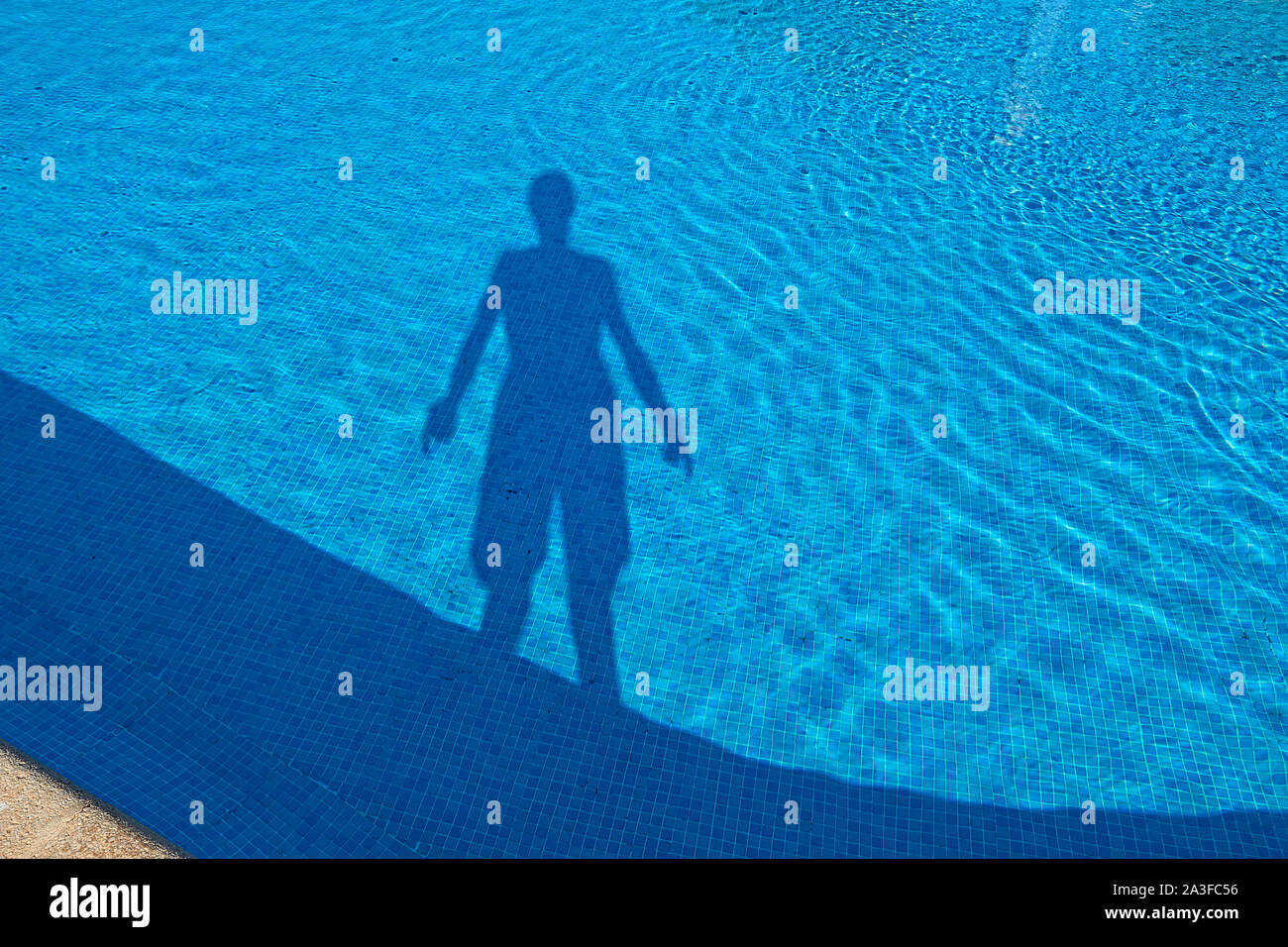 Textured water in swimming pool and hard shadow silhouette Stock Photo ...