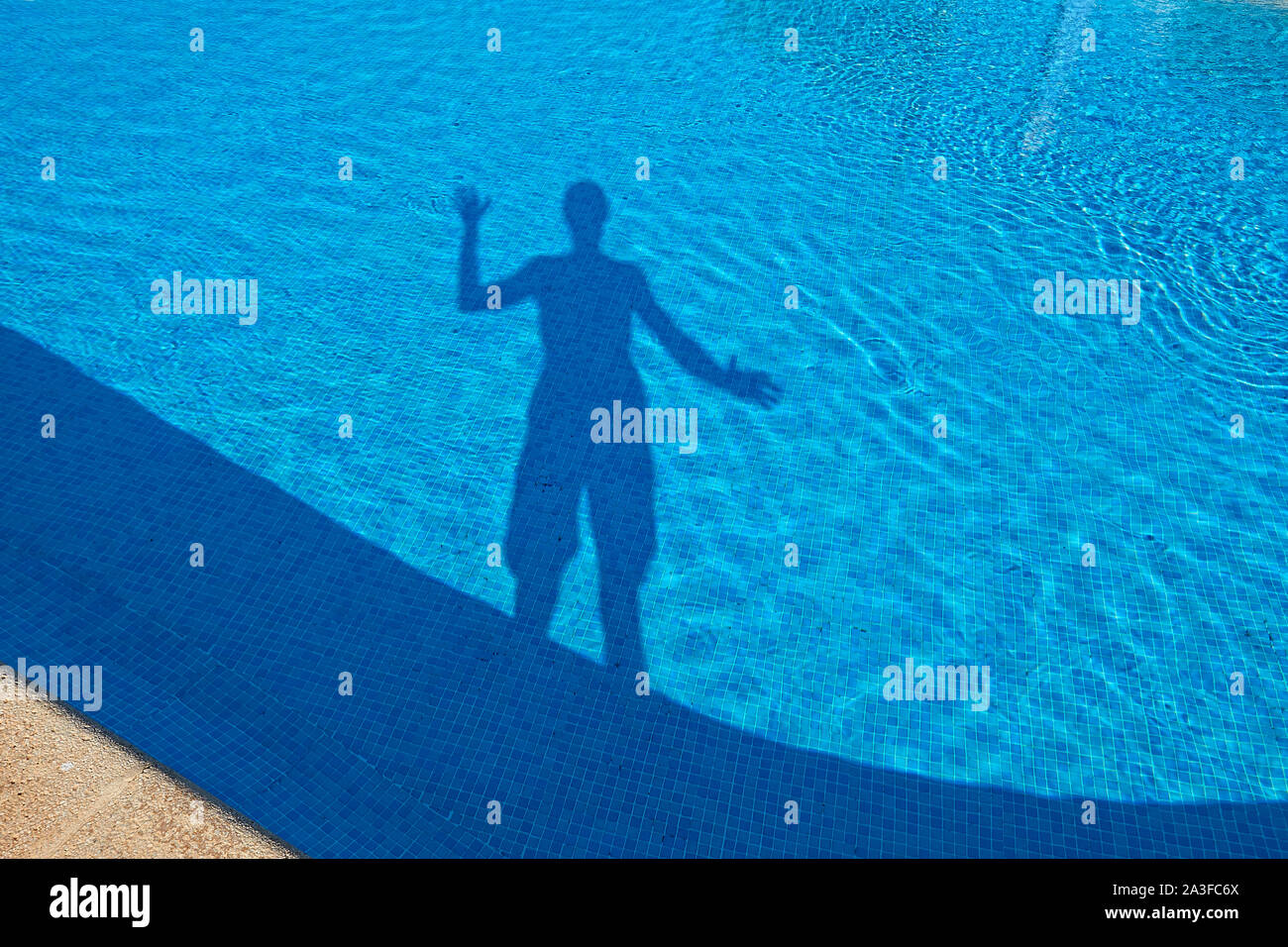 Textured water in swimming pool and hard shadow silhouette Stock Photo ...