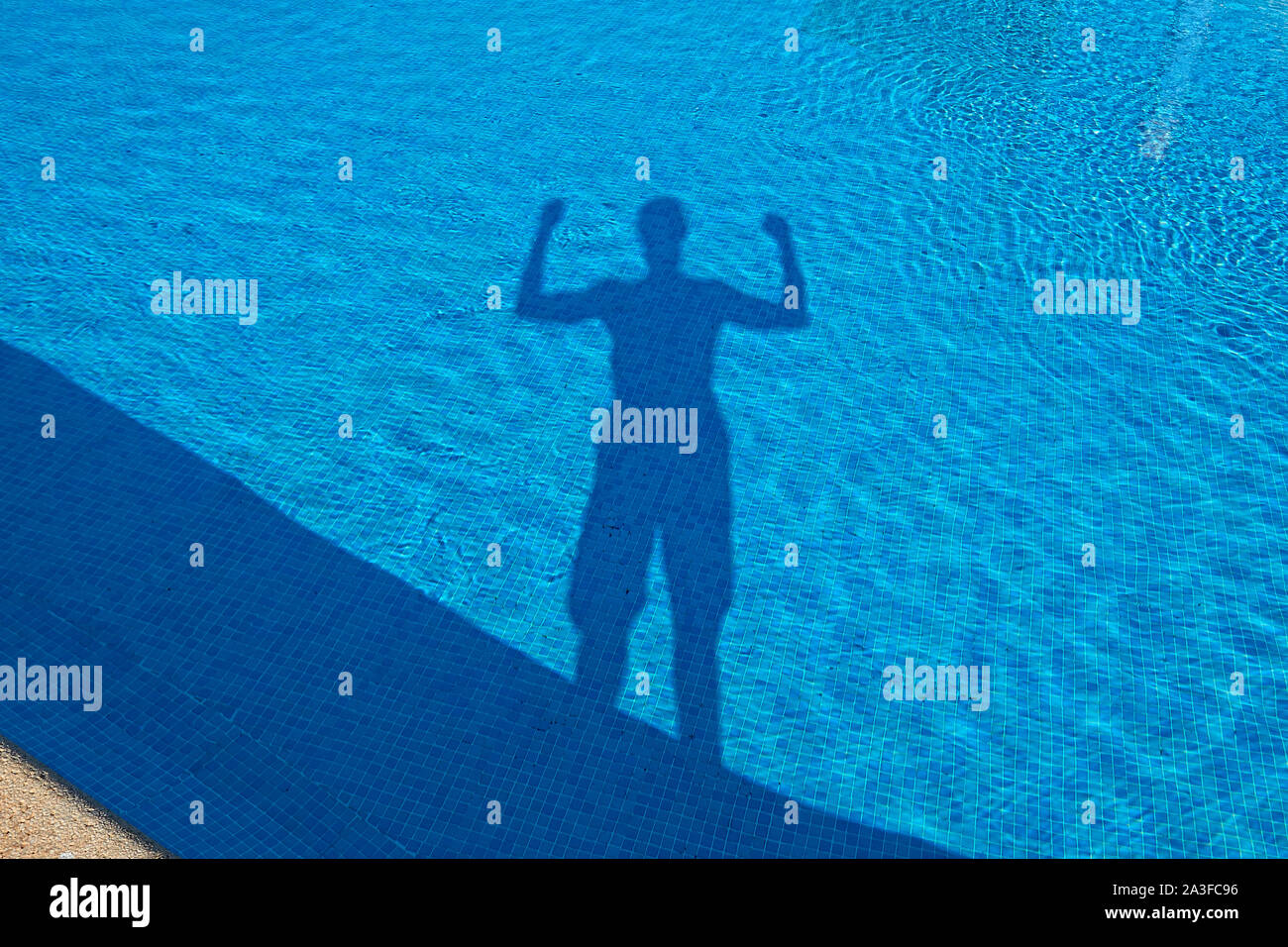Textured water in swimming pool and hard shadow silhouette Stock Photo ...