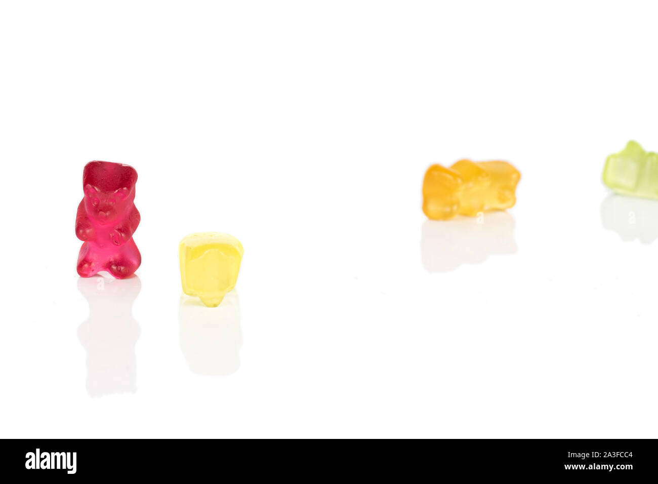 Group of four whole gummy bear isolated on white background Stock Photo ...