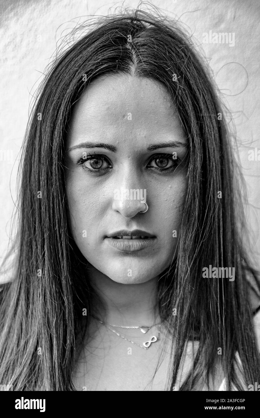 young woman looking at camera with big eyes and sincere look Stock ...