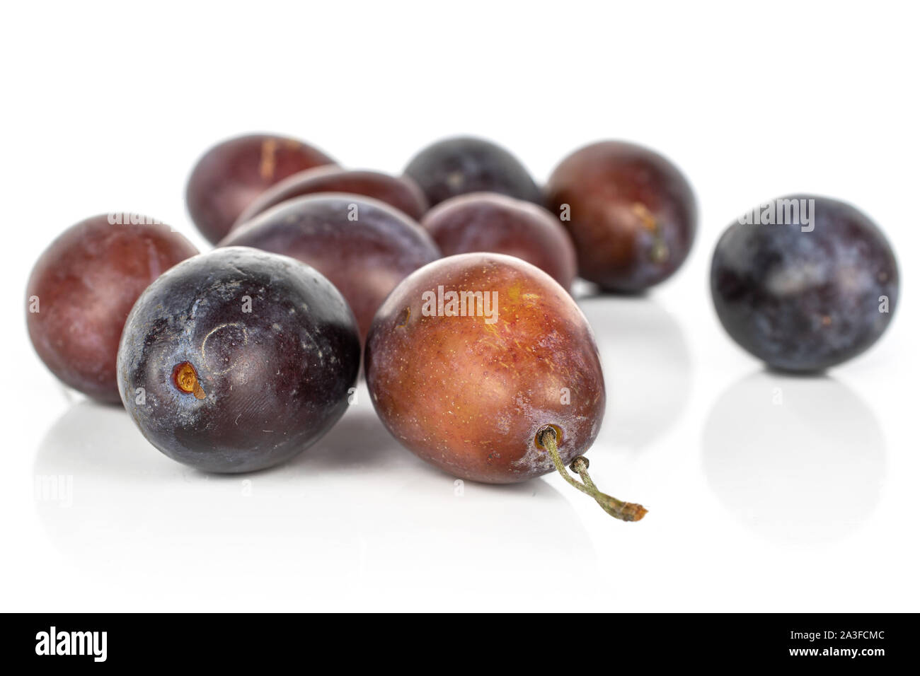 Lot of whole sweet purple plum isolated on white background Stock Photo ...