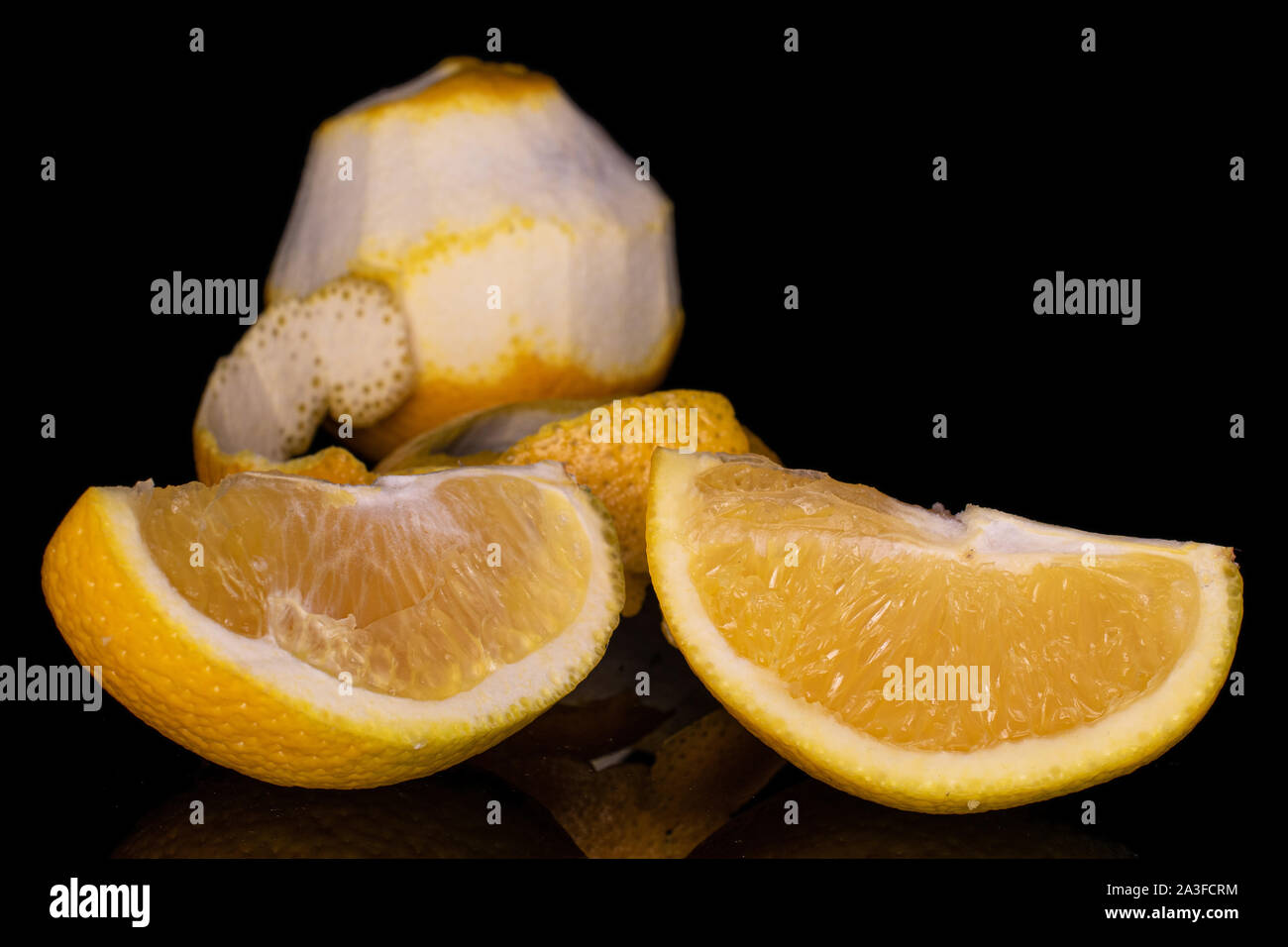 Group of one whole two slices of fresh bright orange isolated on black ...