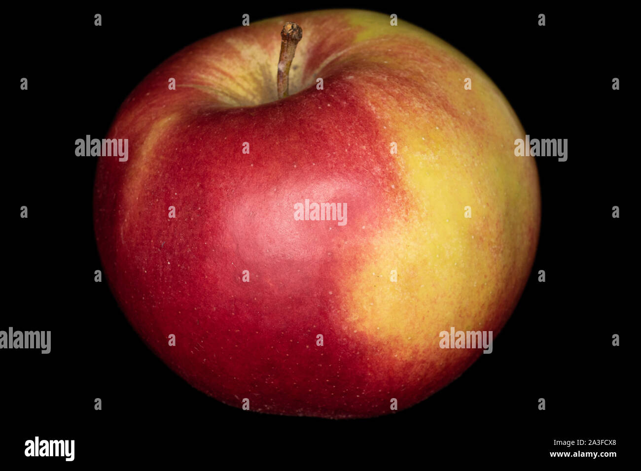 One whole red apple jonagold isolated on black glass Stock Photo - Alamy