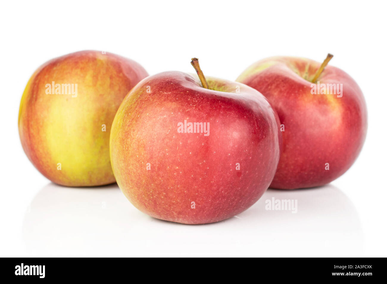 Group of three whole red apple jonagold isolated on white background ...