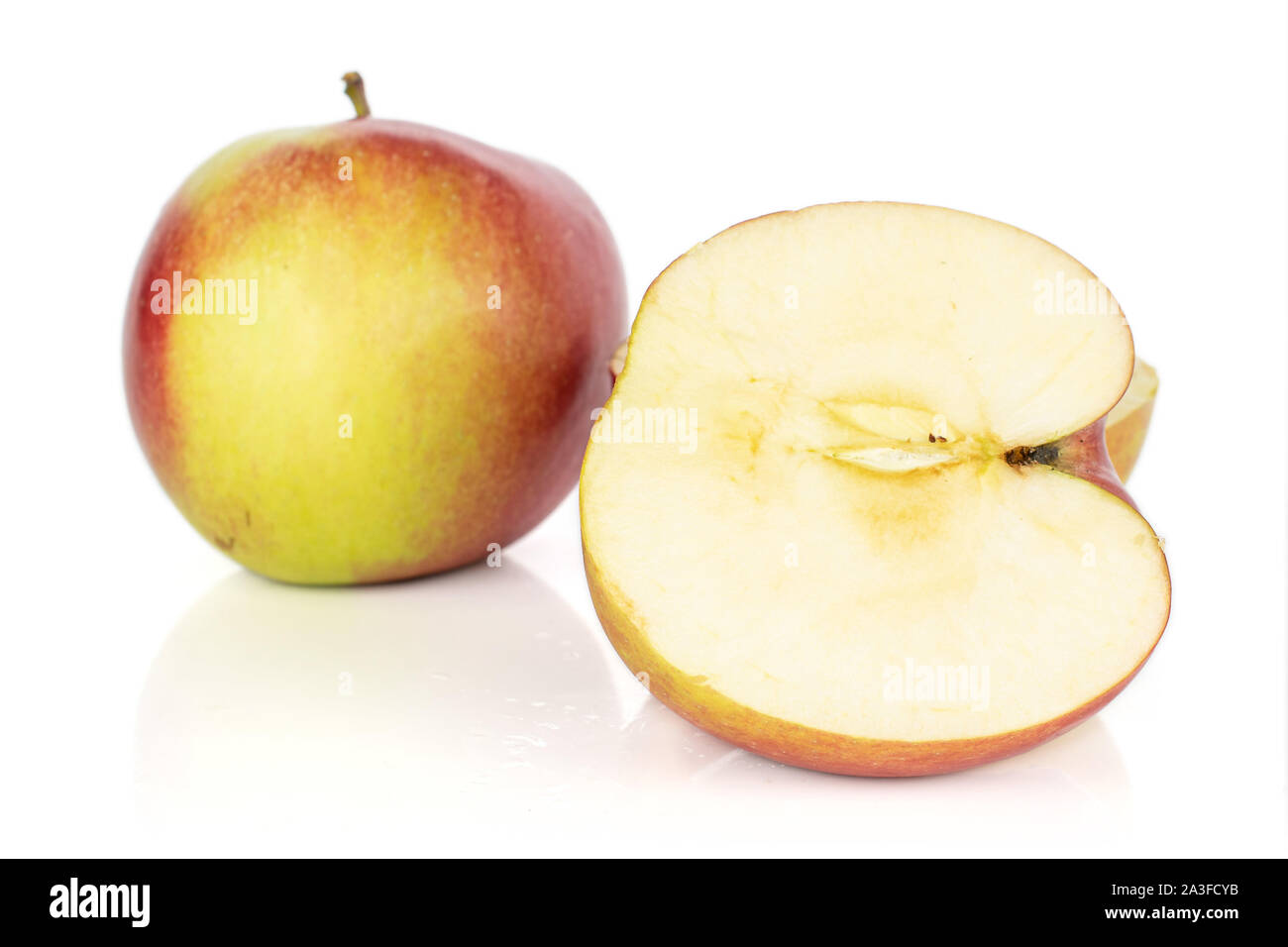 Group of one whole one half of red apple jonagold isolated on white ...