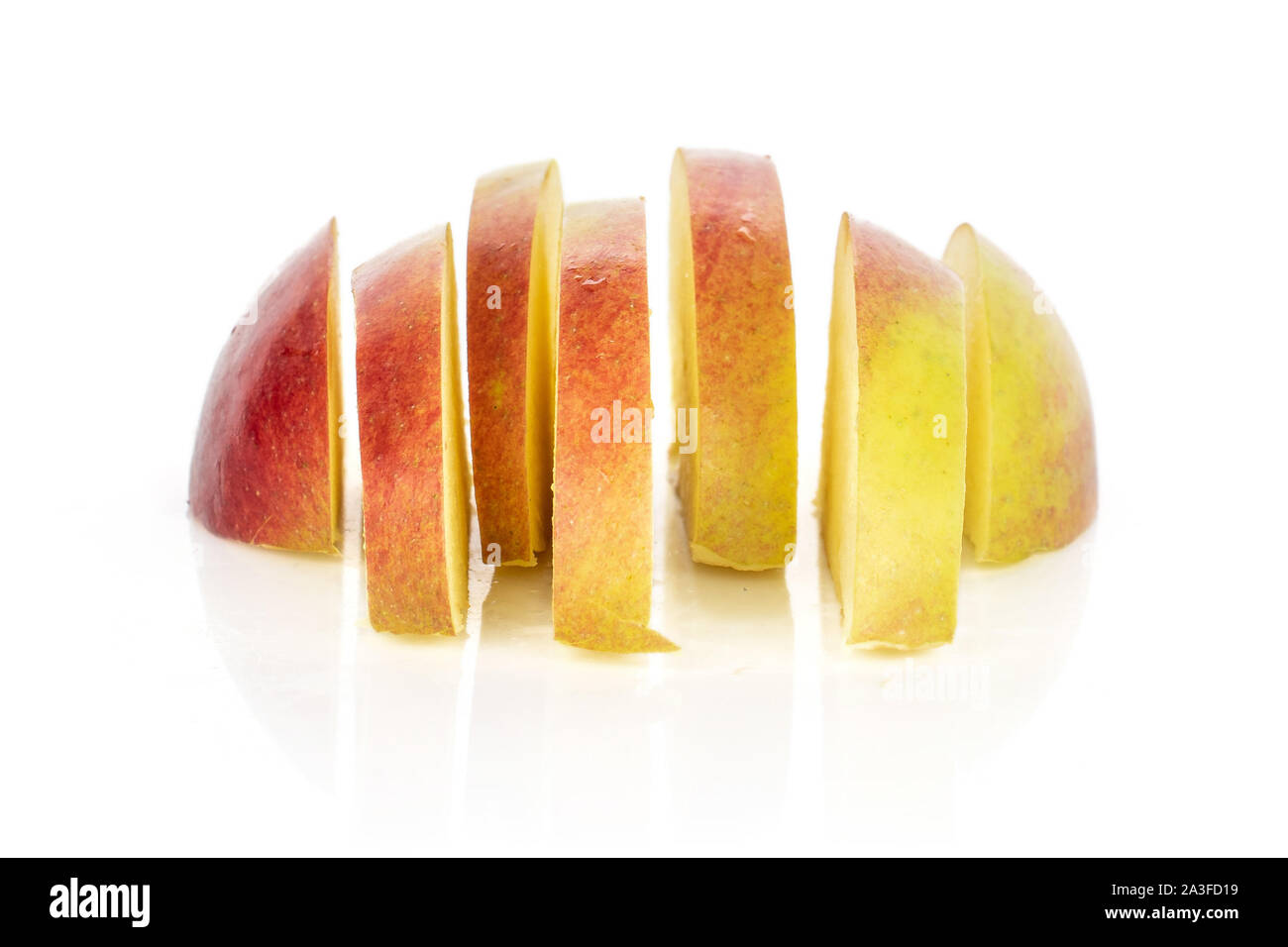 Group of seven slices of red apple jonagold isolated on white ...