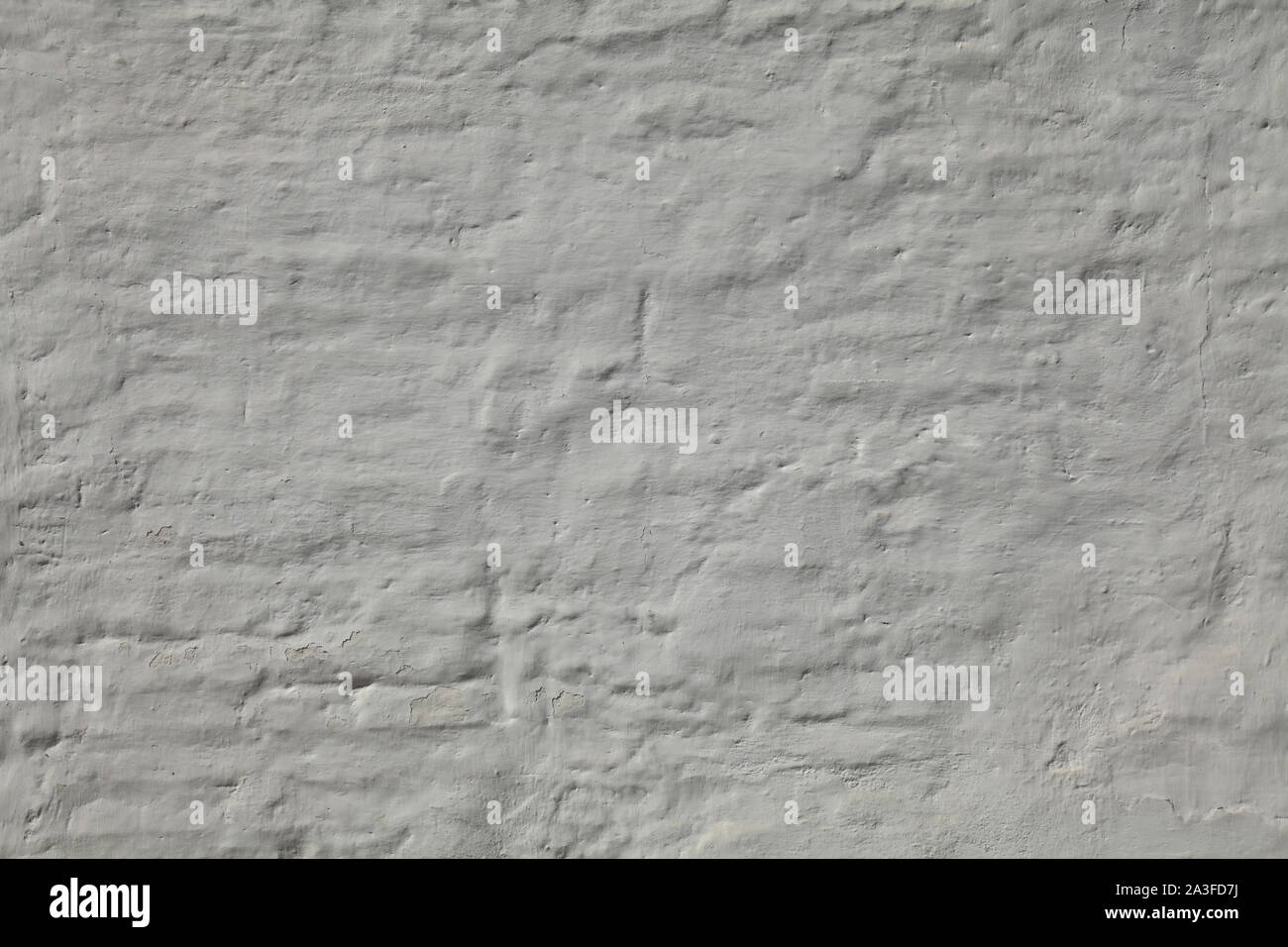 White and uneven wall painted with whitening, texture, background. The ...