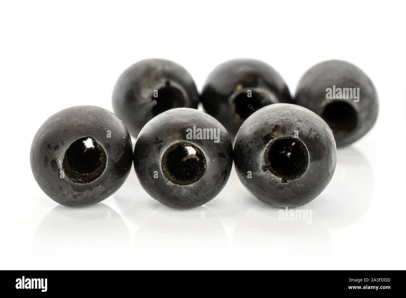 Group of six whole tasty black olive isolated on white background Stock ...