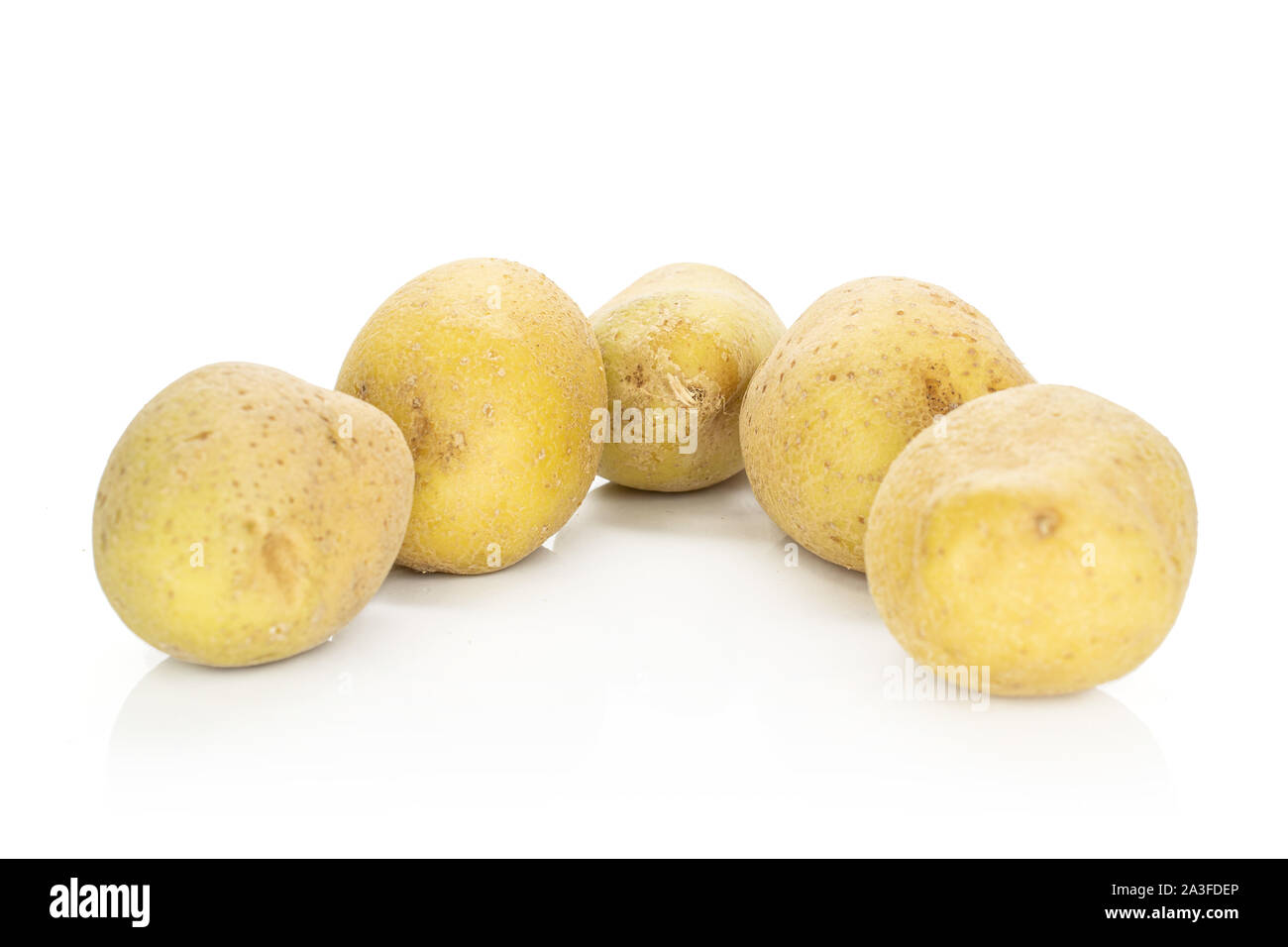 Group of five whole raw brown potato triangle isolated on white ...