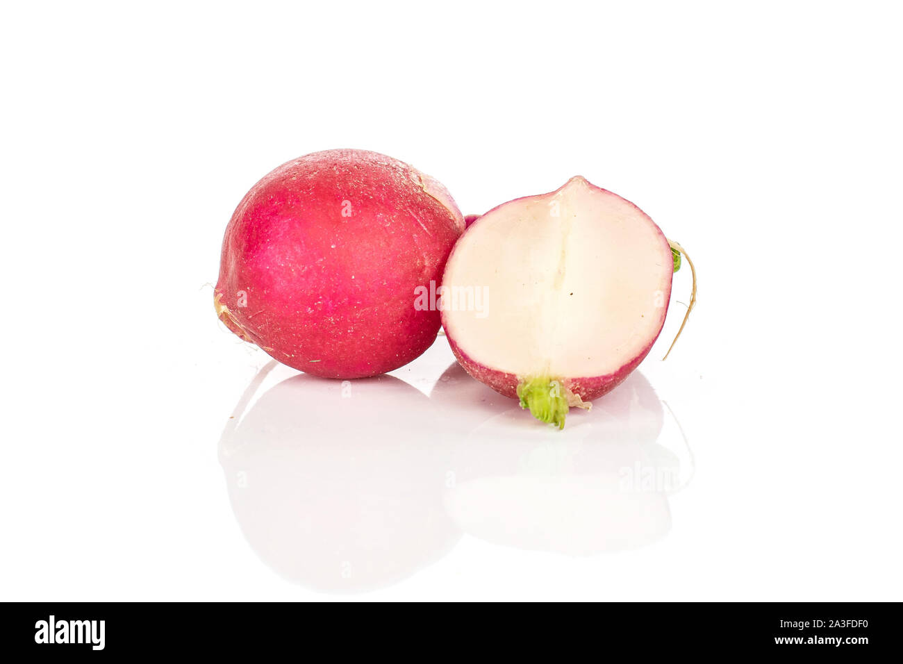 Group of one whole one half of fresh red radish isolated on white ...
