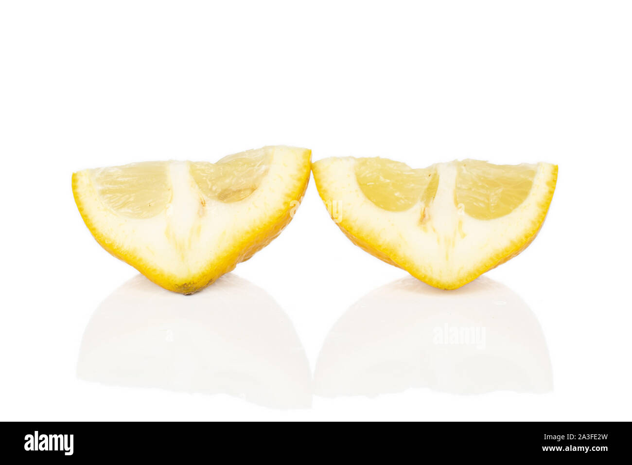 Group of two quarters of fresh yellow lemon isolated on white ...