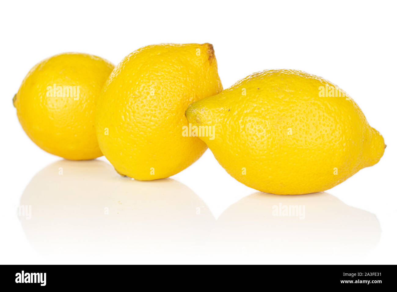 Group of three whole fresh yellow lemon isolated on white background ...
